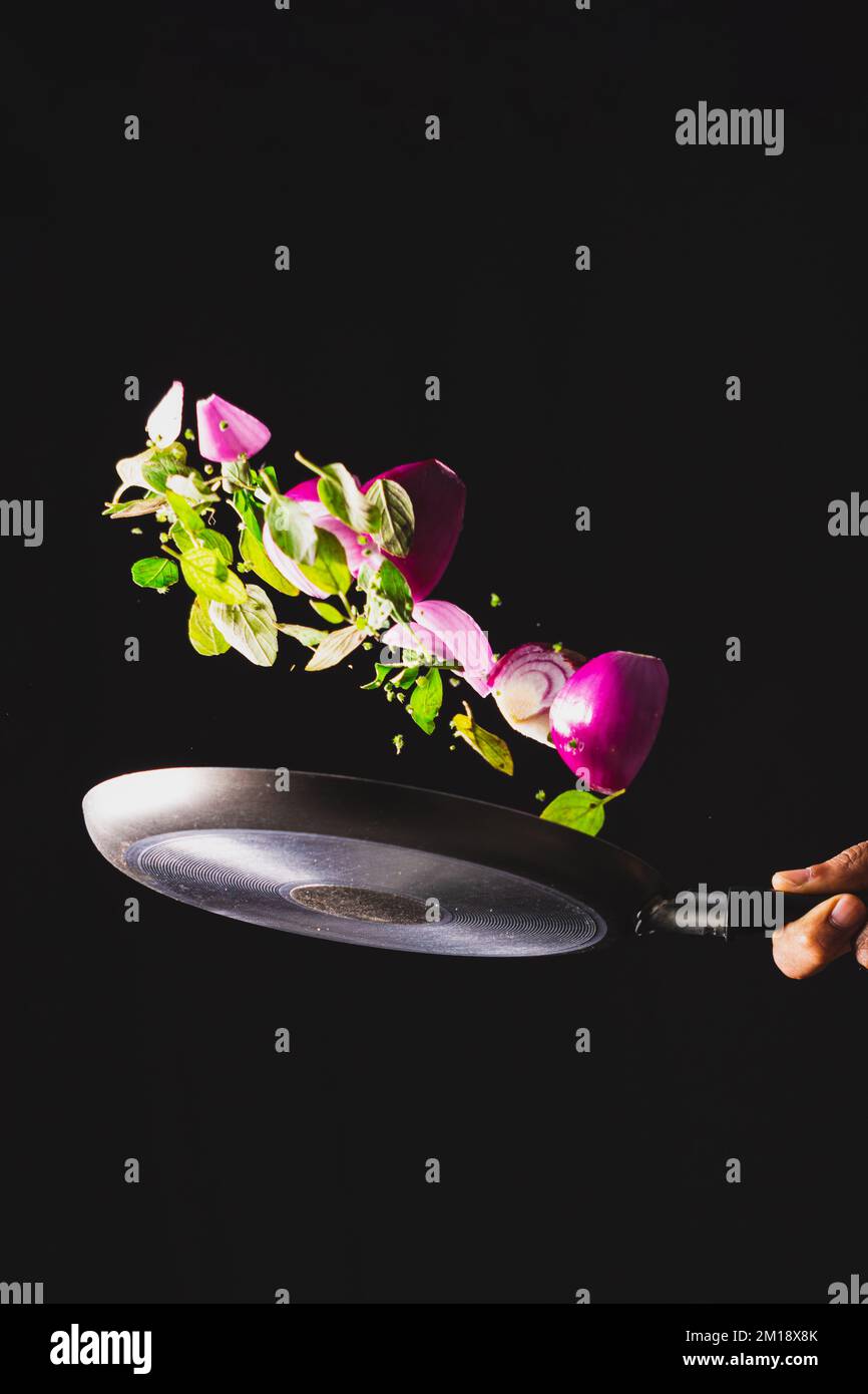 Making Brazilian-style Ceviche on Black Background. Frying Pan Throwing ...