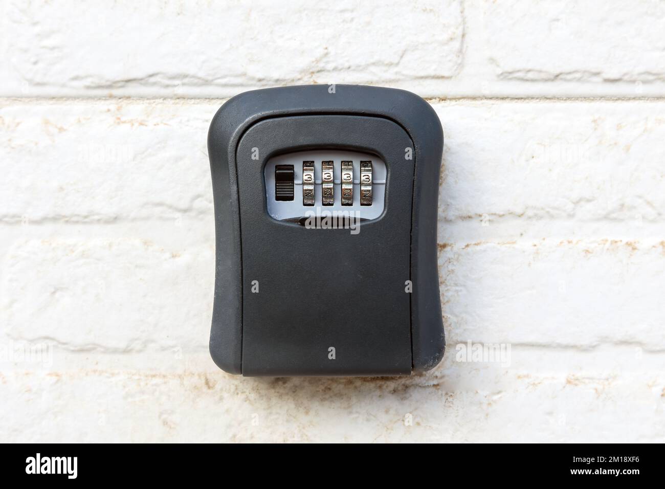 A closeup of a key storage lock box on a white wall Stock Photo - Alamy