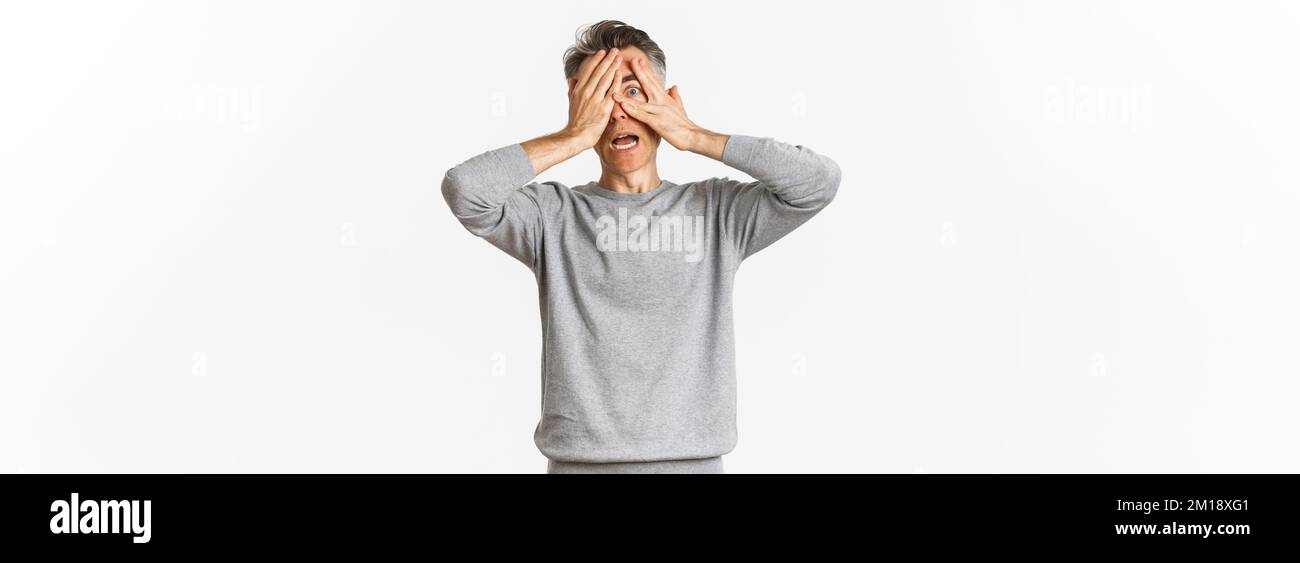 Image of embarrassed of scared middle-aged man cover his eyes with ...