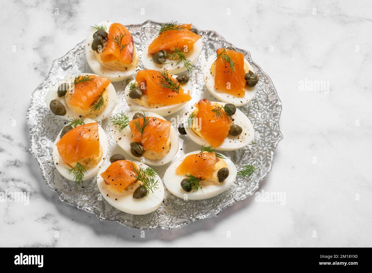 delicious smoked salmon deviled eggs with capers and dill Stock Photo ...
