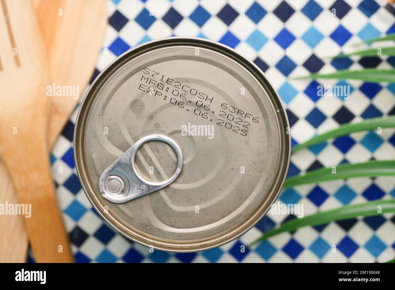 expire date on food can on white background Stock Photo - Alamy
