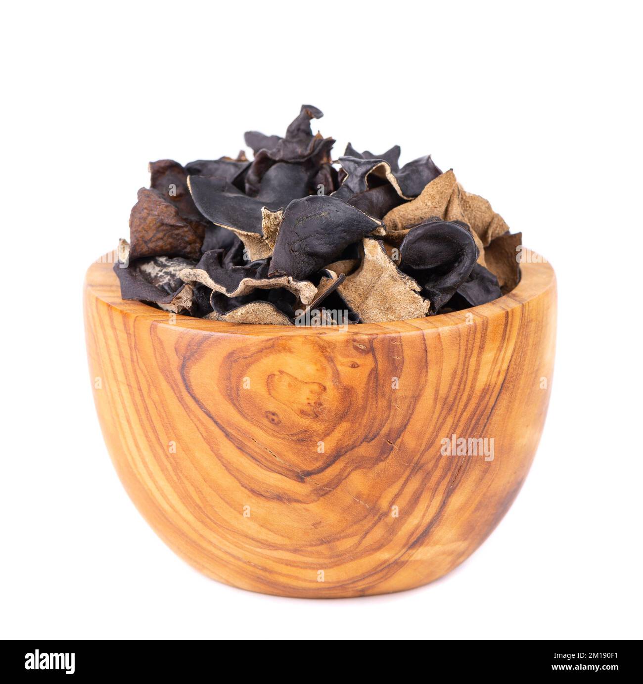 Dry black fungus in wooden bowl, isolated on white background. Chinese ...