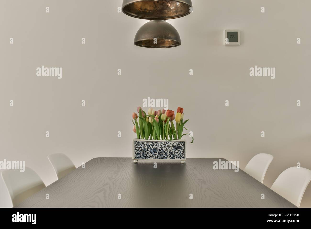 Dining table with hanging chairs hi-res stock photography and images ...