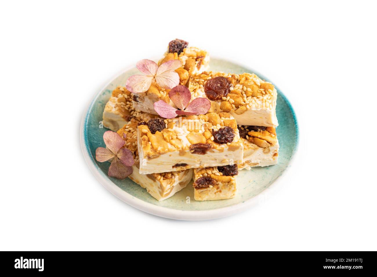 Traditional candy nougat with nuts and sesame isolated on white ...