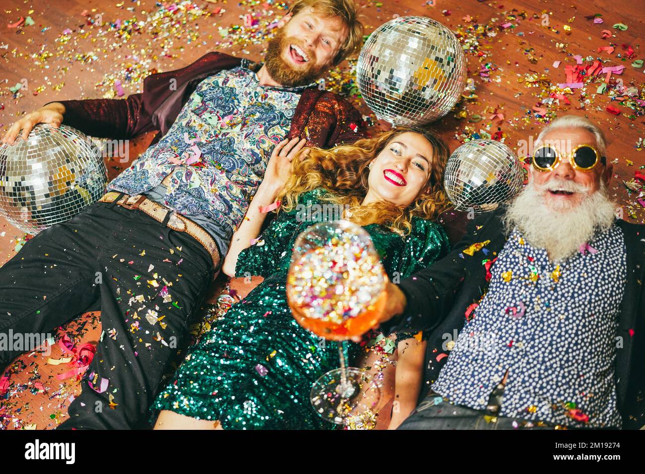 Generational crazy people celebrating new year party together - Soft ...