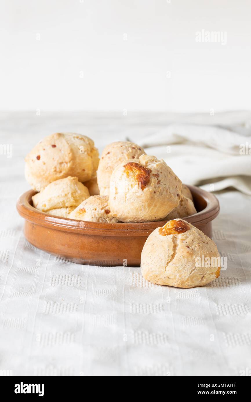 Chipa, typical Paraguayan cheese bread on white tablecloth Stock Photo ...