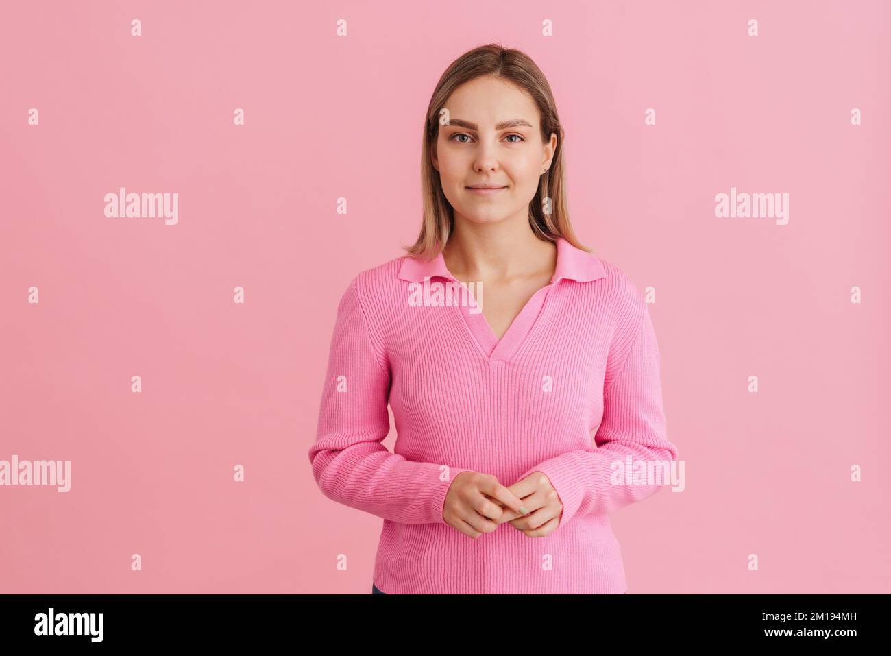 Young beautiful white woman wearing shirt smiling and looking at camera ...