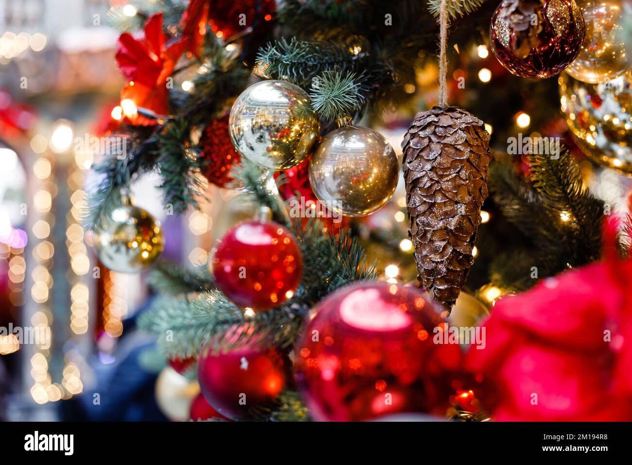 Close up of balls on christmas tree. Bokeh garlands in the background ...