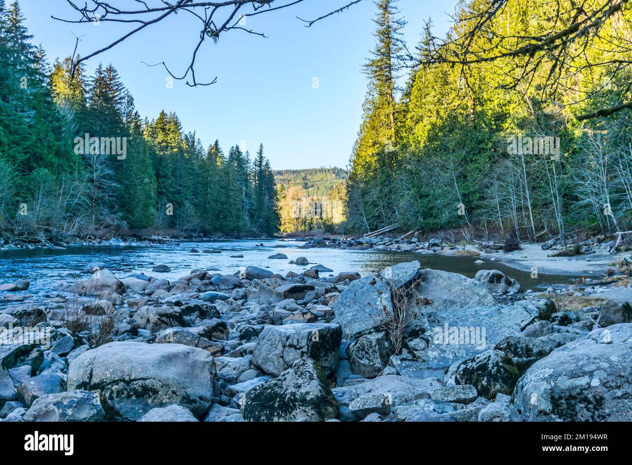 Large rocks line the Snoqualmie River in Washington State Stock Photo ...