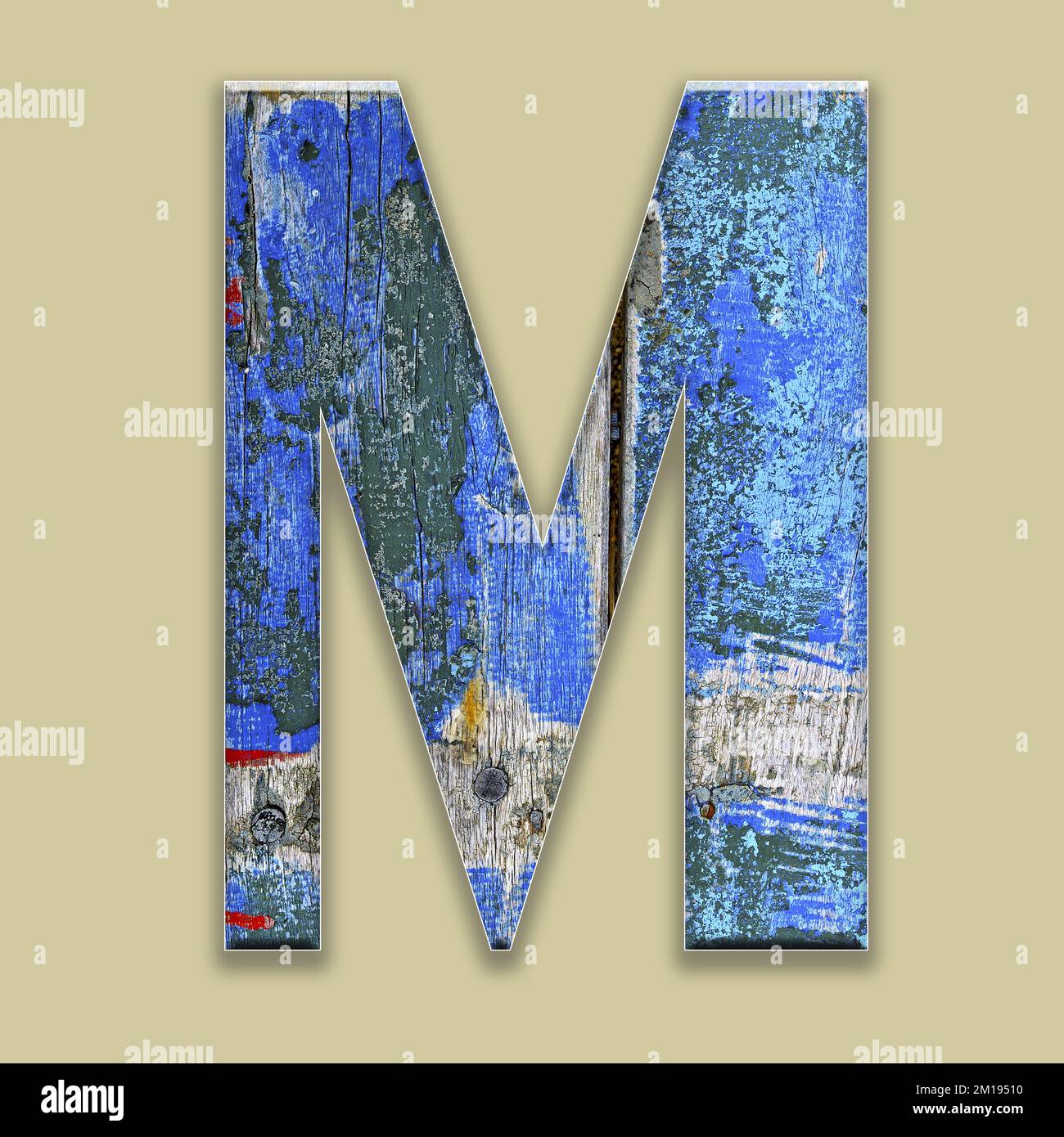 Monogram with capital letter M, Design Old painted wood Stock Photo - Alamy