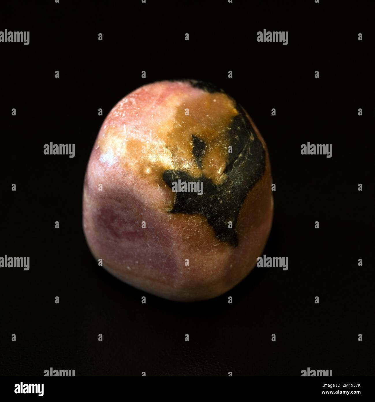 Macro close up colour photograph of 'Rhodonite' a semi precious crystal ...