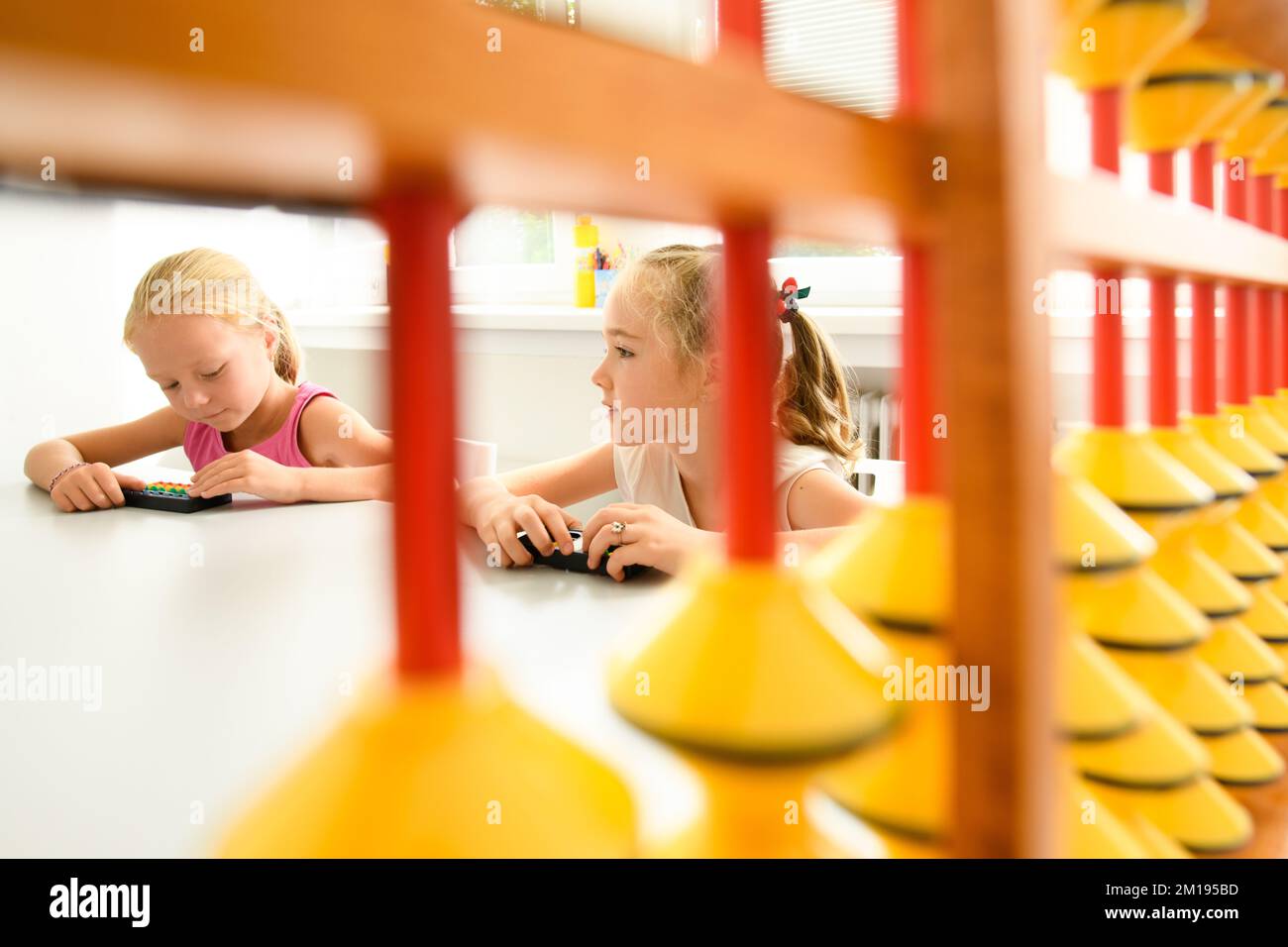 Children with learning difficulty in occupational therapy. Girls doing ...