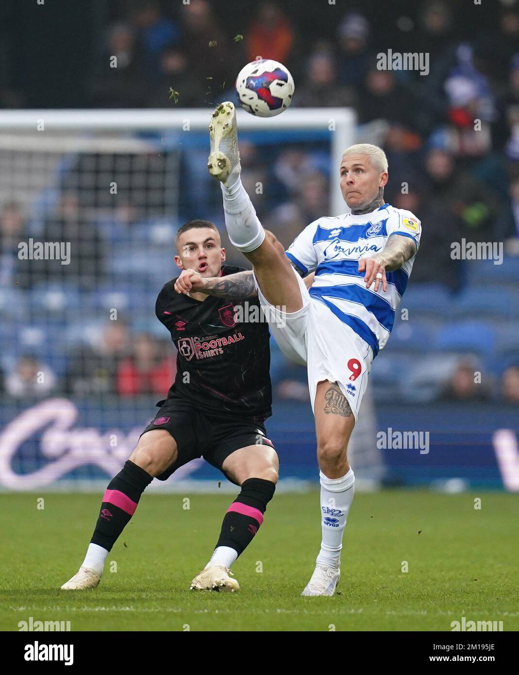 Burnley's Taylor Harwood-Bellis (left) and Queens Park Rangers' Lyndon ...