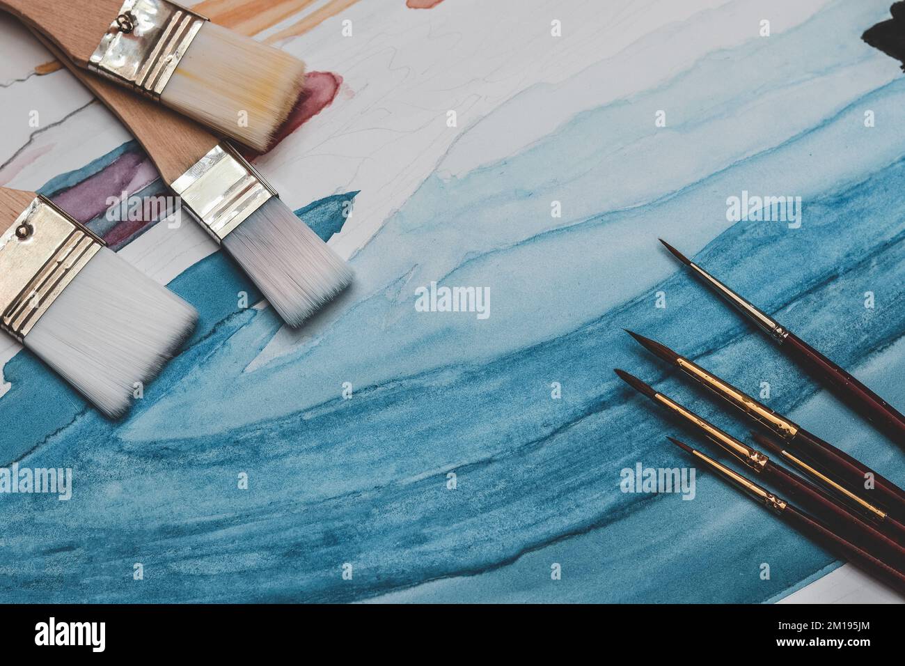 Artist props collection on table. composition of messy stationery tools ...