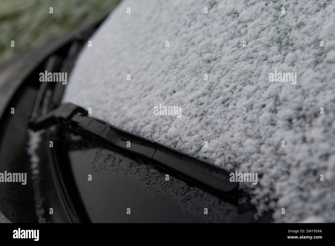 Snow and ice on car windscreen dangerous weather and driving conditions ...
