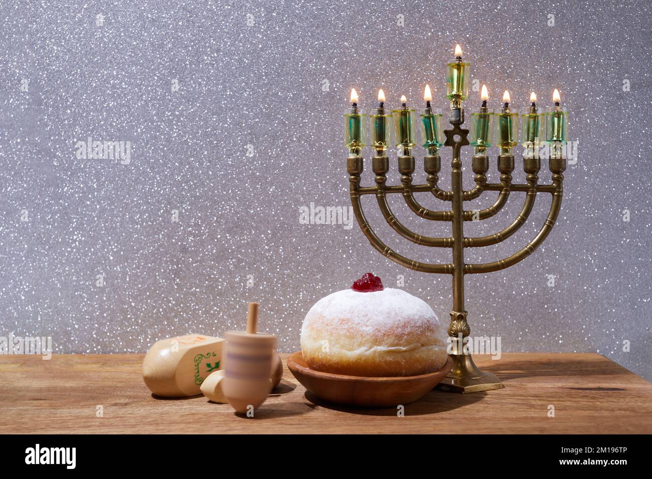 Jewish holiday Hanukkah background with menorah and dreidel with ...