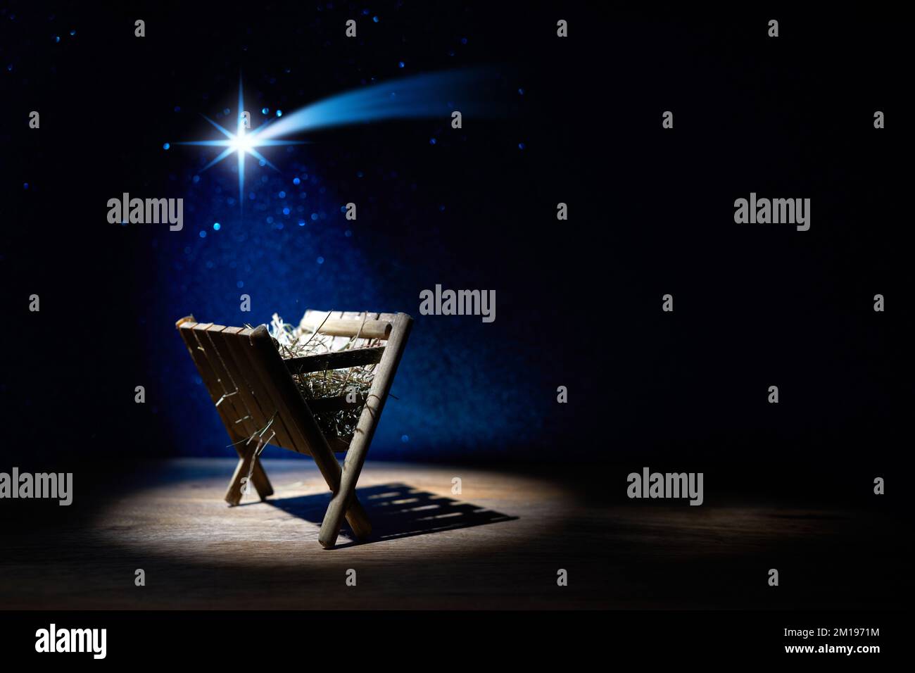 Nativity of Jesus, empty manger at night with bright lights Stock Photo ...