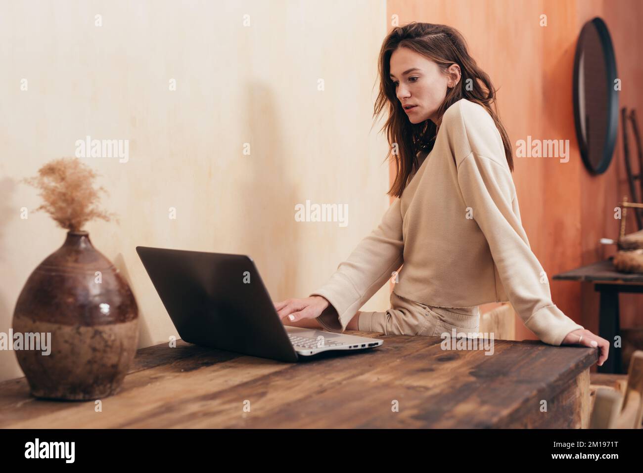 Woman working remotely standing hi-res stock photography and images - Alamy