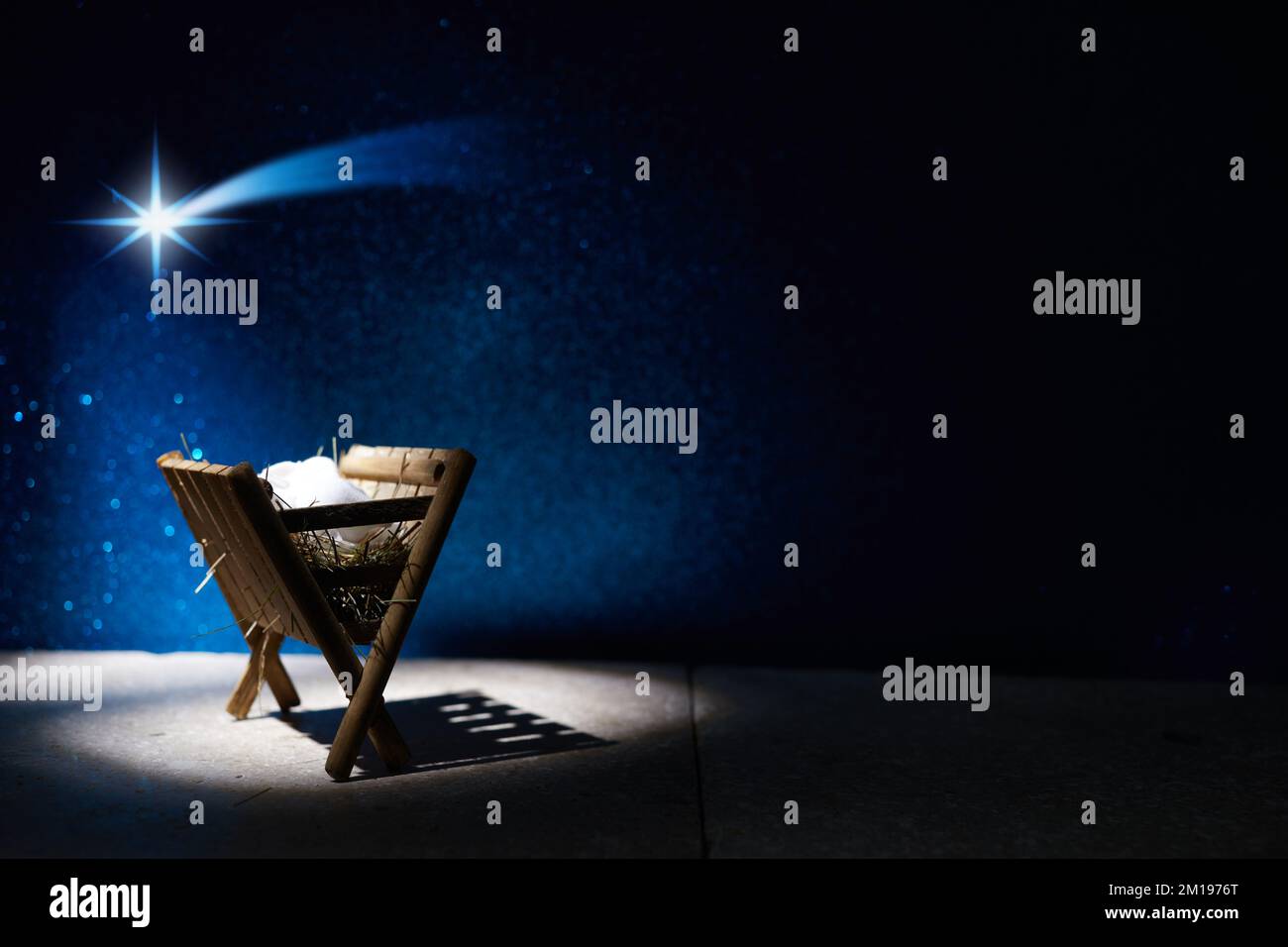 Nativity of Jesus, empty manger at night with bright lights Stock Photo ...