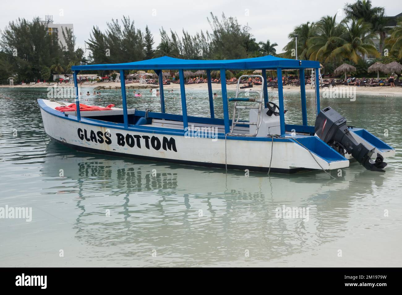 A glass bottom boat moored in Montego Bay, Jamaica Stock Photo - Alamy