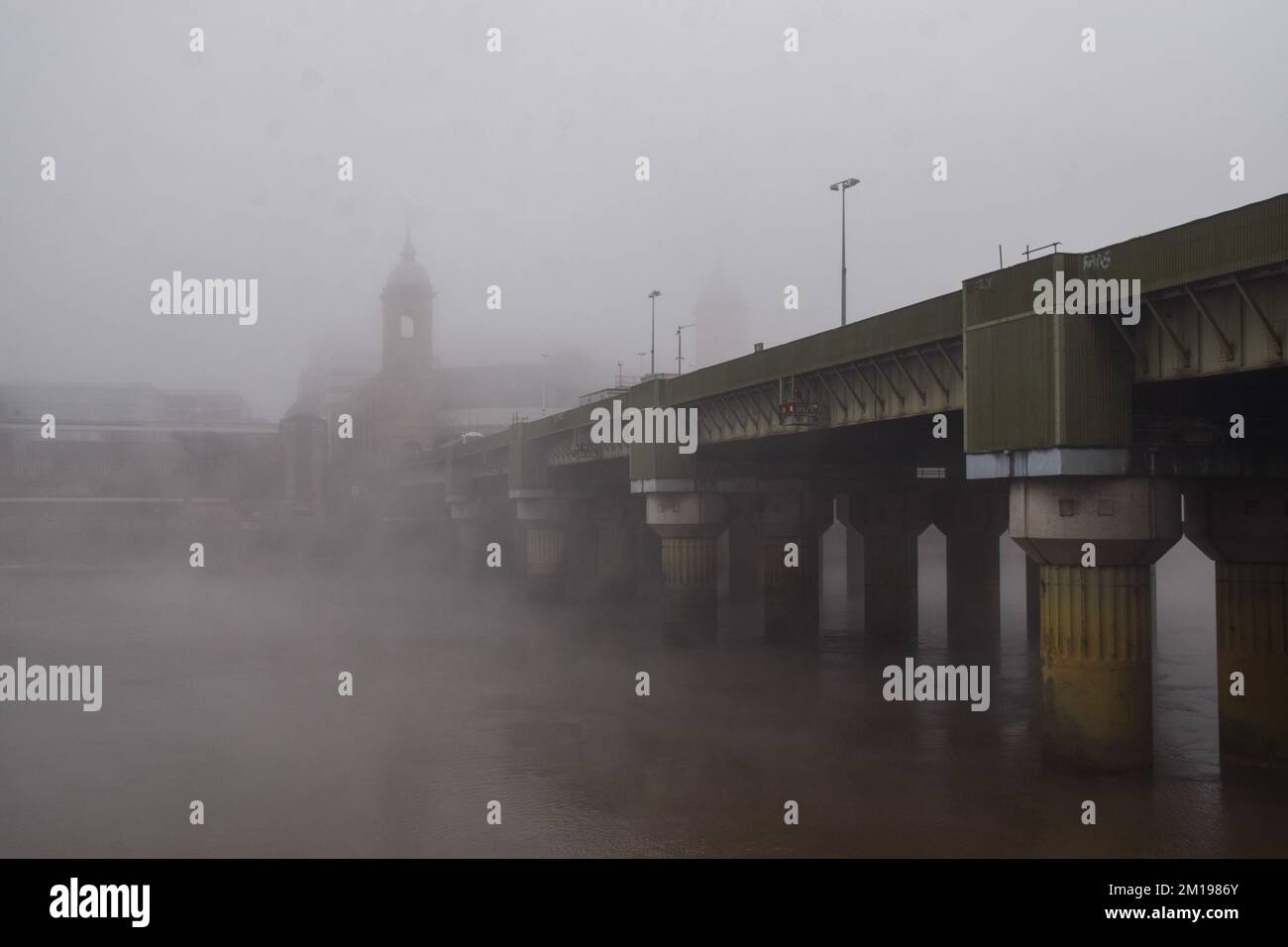 London, UK. 11th December 2022. The City of London skyline disappears ...