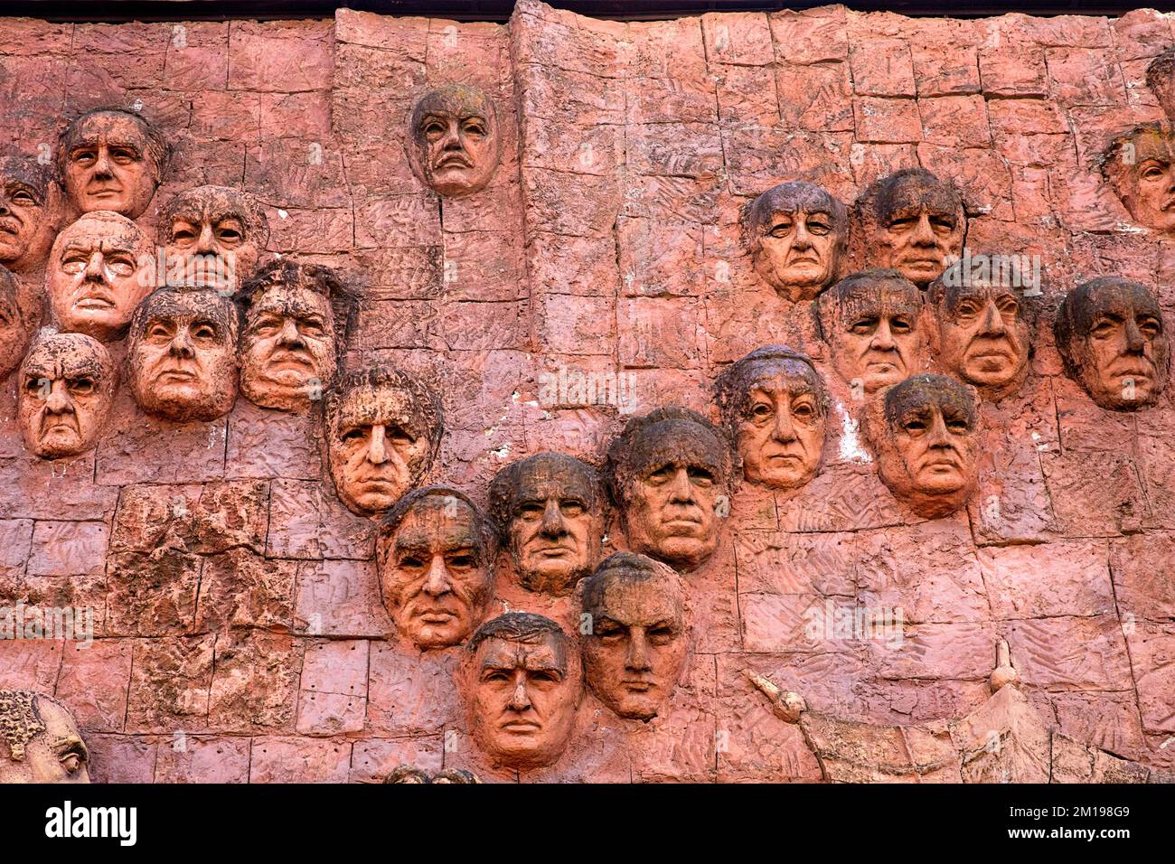 Close-up of carved Faces on the exterior wall of Kutaisi Market ...