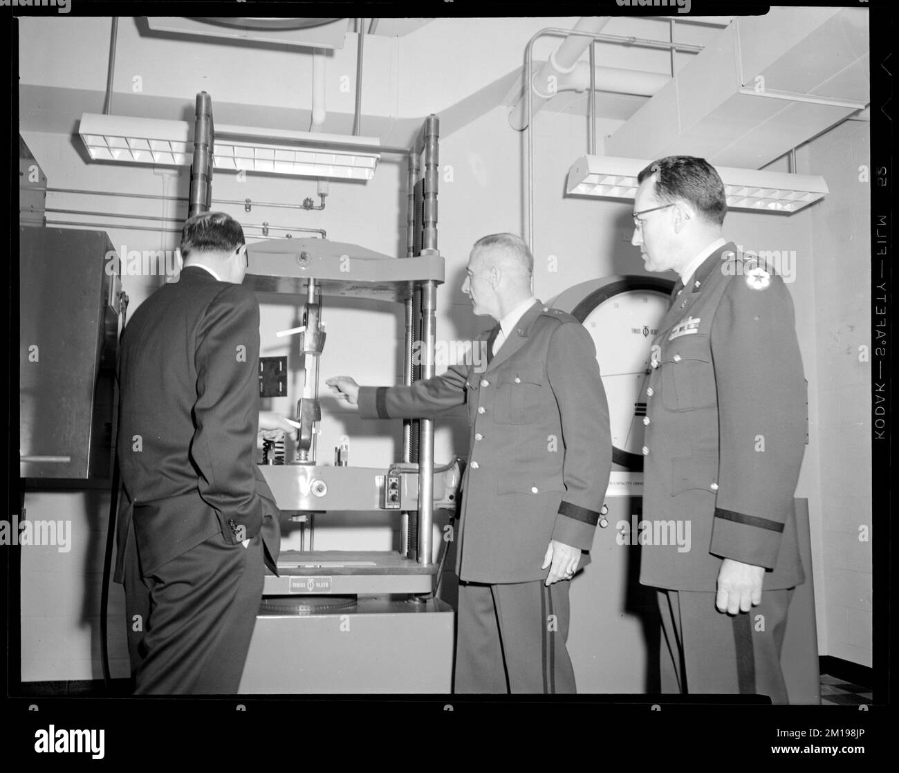 Three men and machine , Armories, Ordnance industry, Military officers ...
