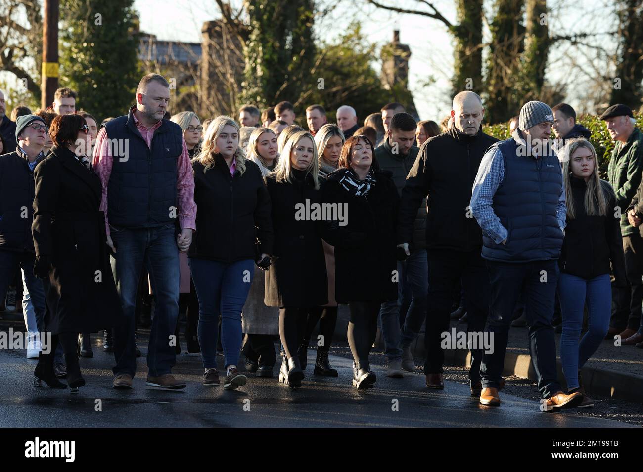 Mourners and family members attending the funeral of 15-year-old ...
