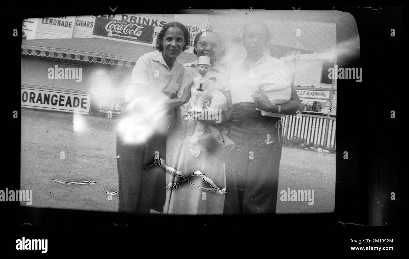Three women stand holding a ventriloquist dummy , Puppets. Jack Miller ...