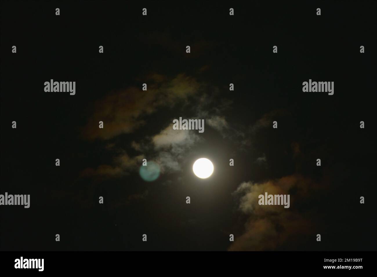 full moon cover by spreading cloud in night Stock Photo - Alamy