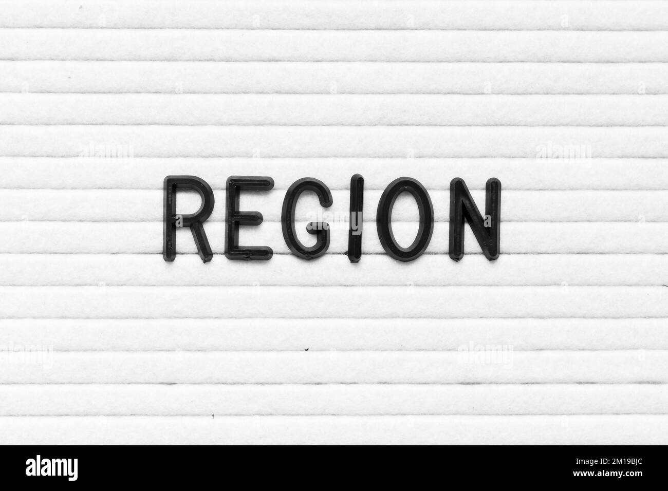 Black color letter in word region on white felt board background Stock ...