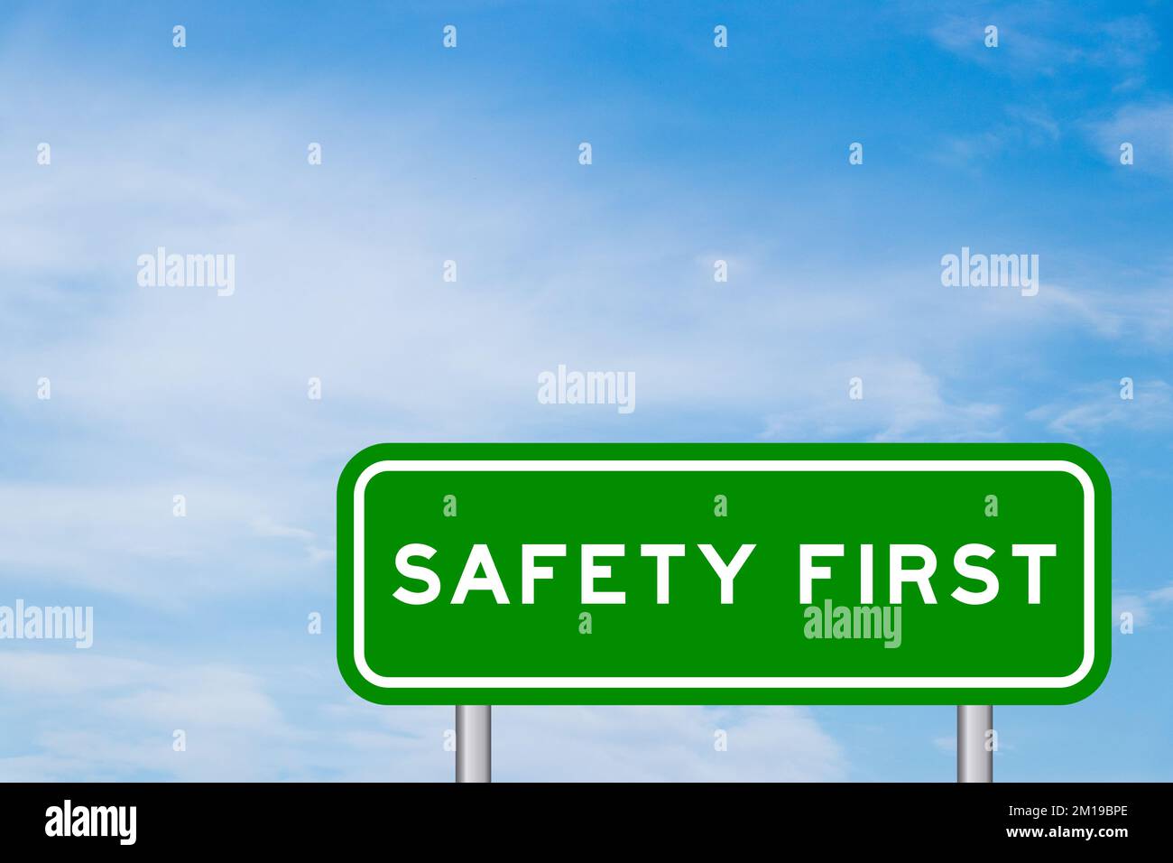 Green color transportation sign with word safety first on blue sky with ...