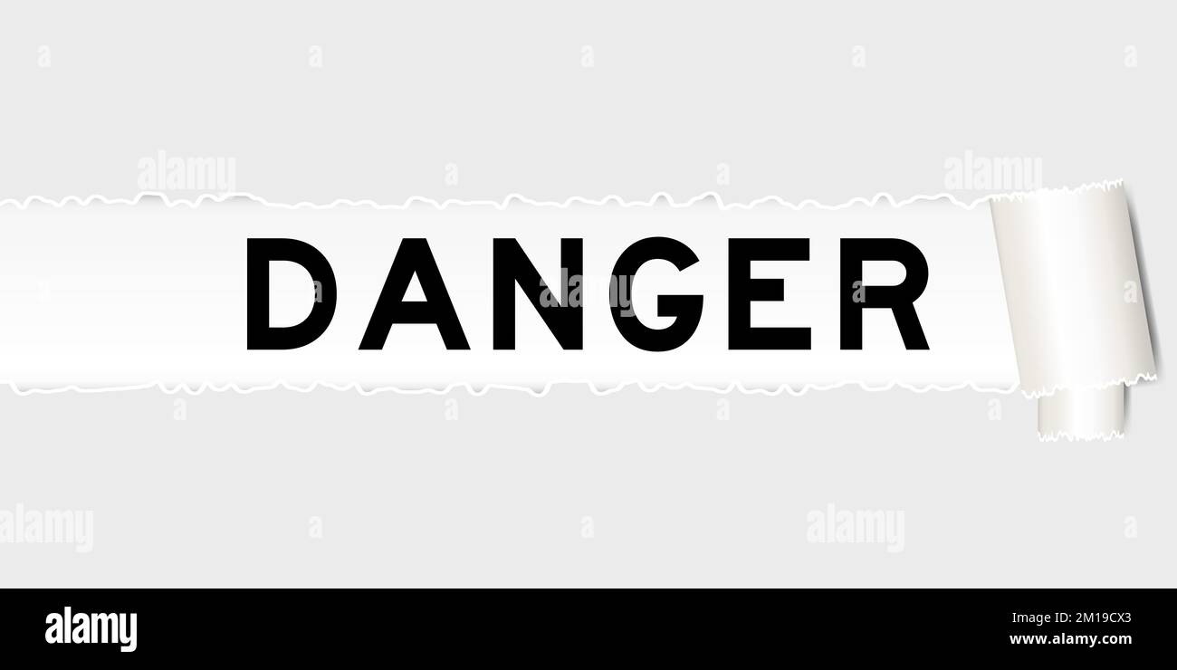 Ripped gray paper background that have word danger under torn part ...