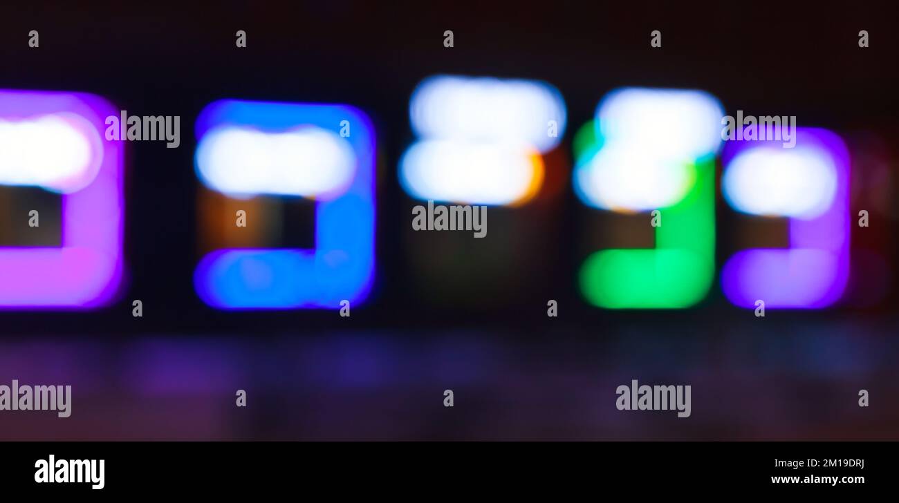 Blurred neon lights in windows. Street advertising, abstract unfocused ...