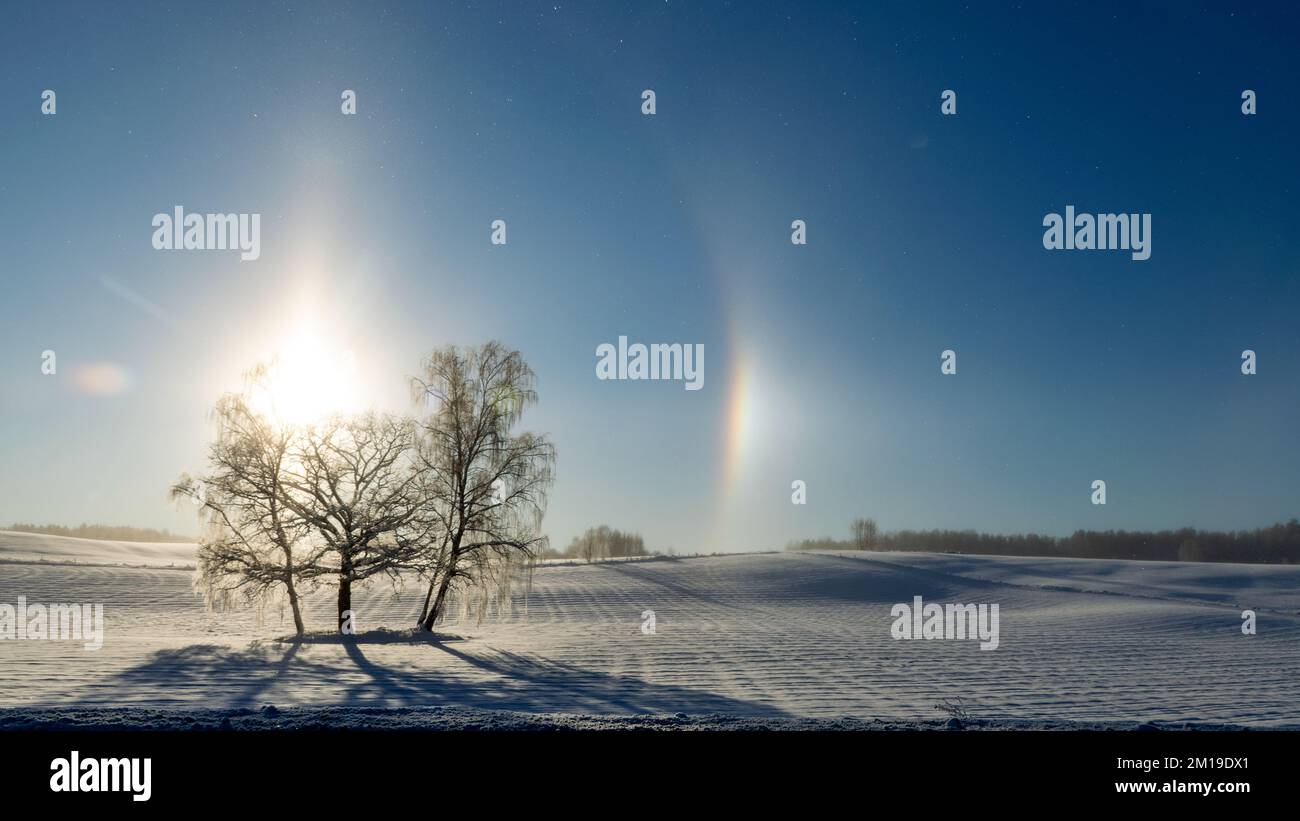 Halo effect on a winter morning. Sunny and shining light, cold weather ...