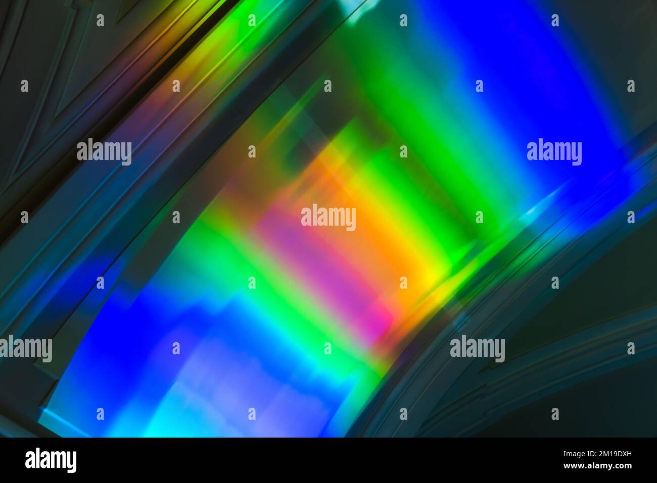 Colorful holographic light pattern over dark wall, abstract background ...