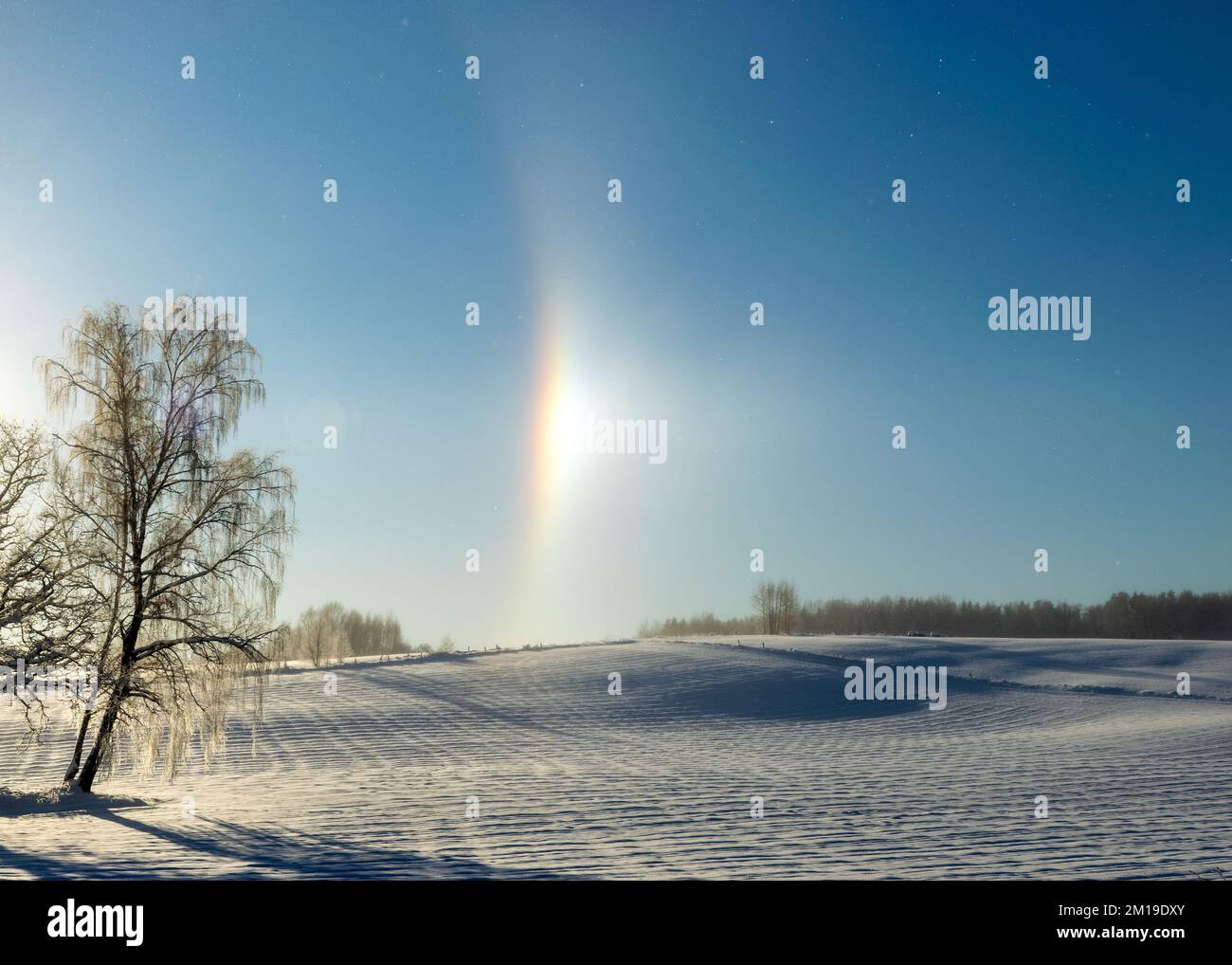 Halo effect on a winter morning. Sunny and shining light, cold weather ...