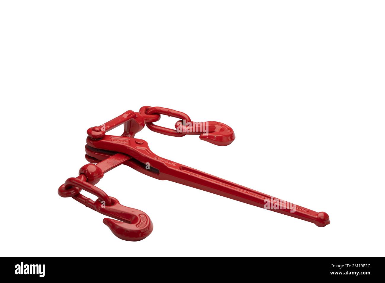 A metallic red ratchet chain binder for securing the load isolated on ...