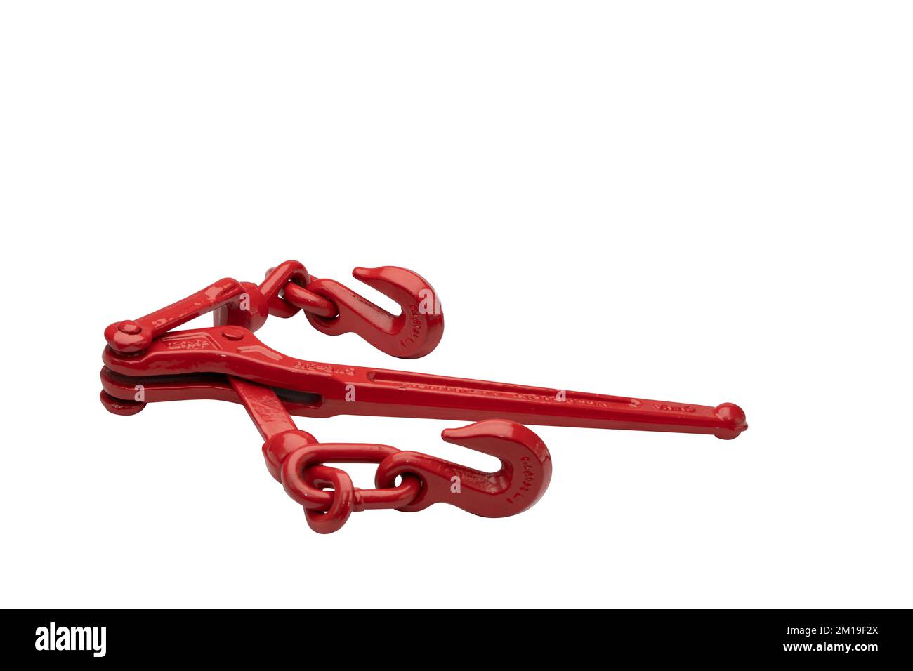 A metallic red ratchet chain binder for securing the load isolated on ...