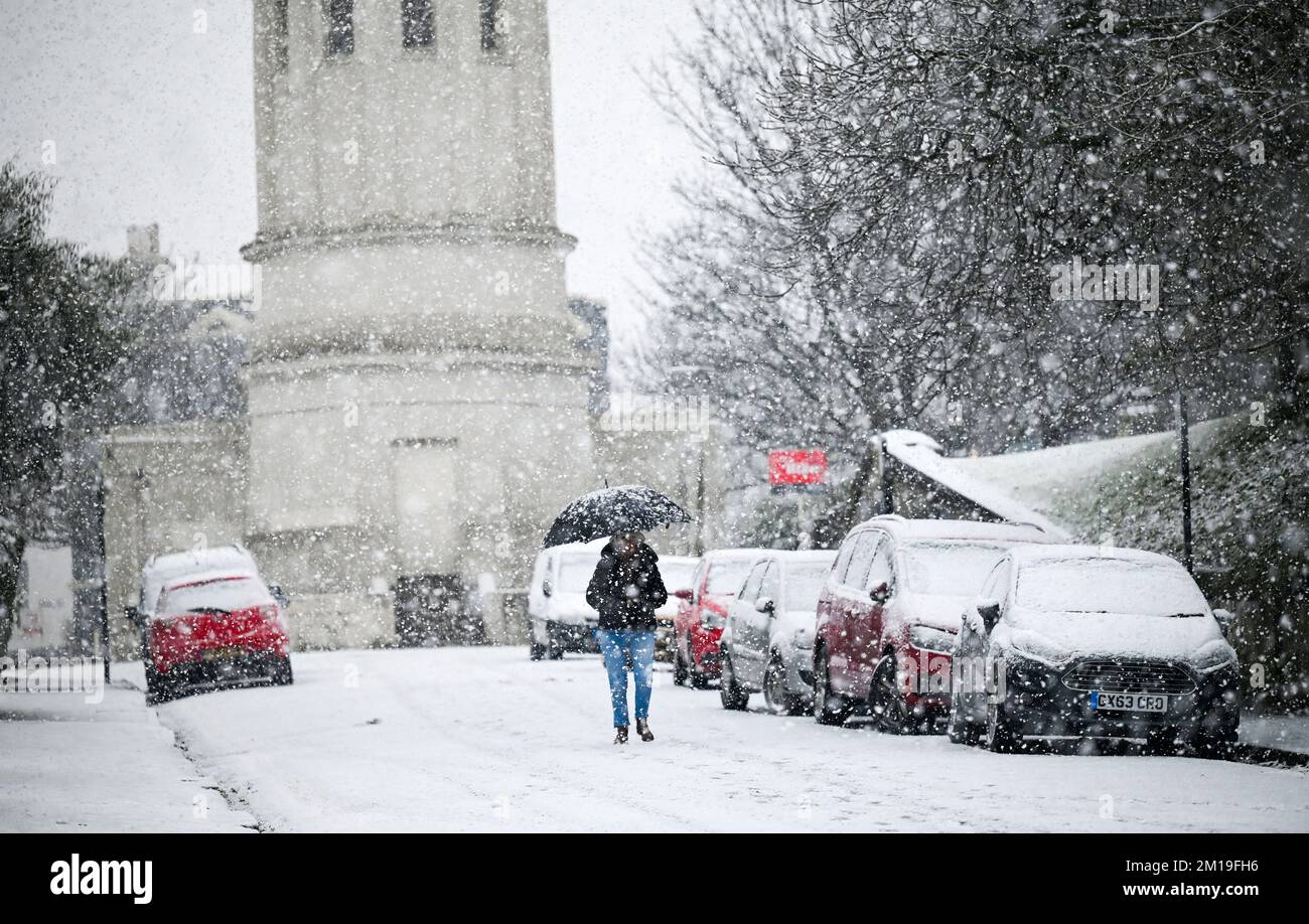 Brighton UK 11th December 2022 - Heavy snow falling in the Queens Park ...