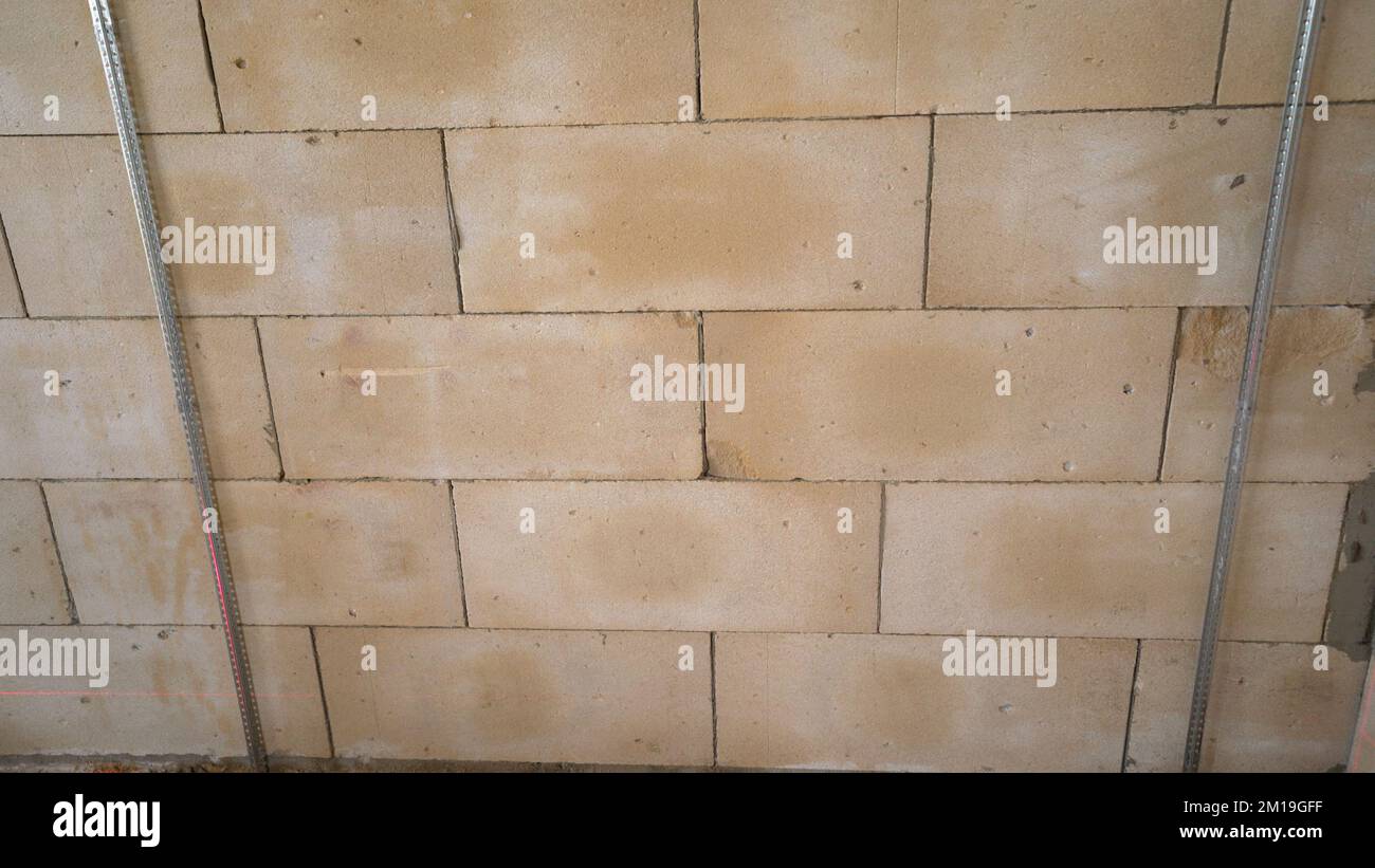 Fragment of a wall. Foundation preparation, priming, installation of ...