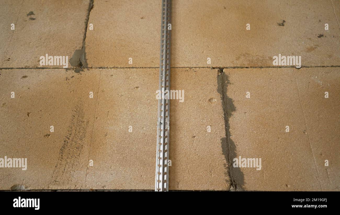 Fragment of a wall. Foundation preparation, priming, installation of ...