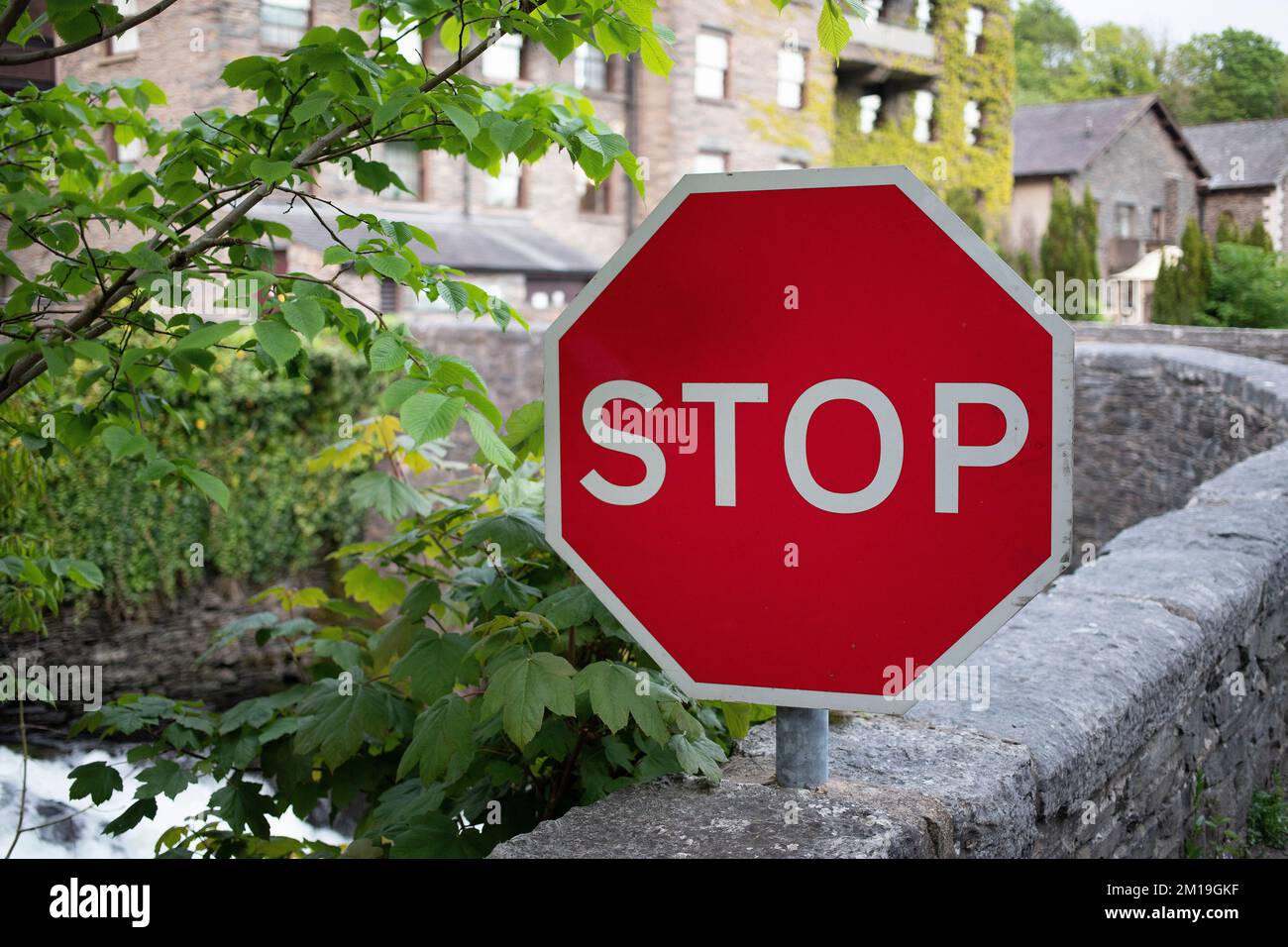 Stop sign at The Lakeland Village, Backbarrow, Ulverston, with a rural ...