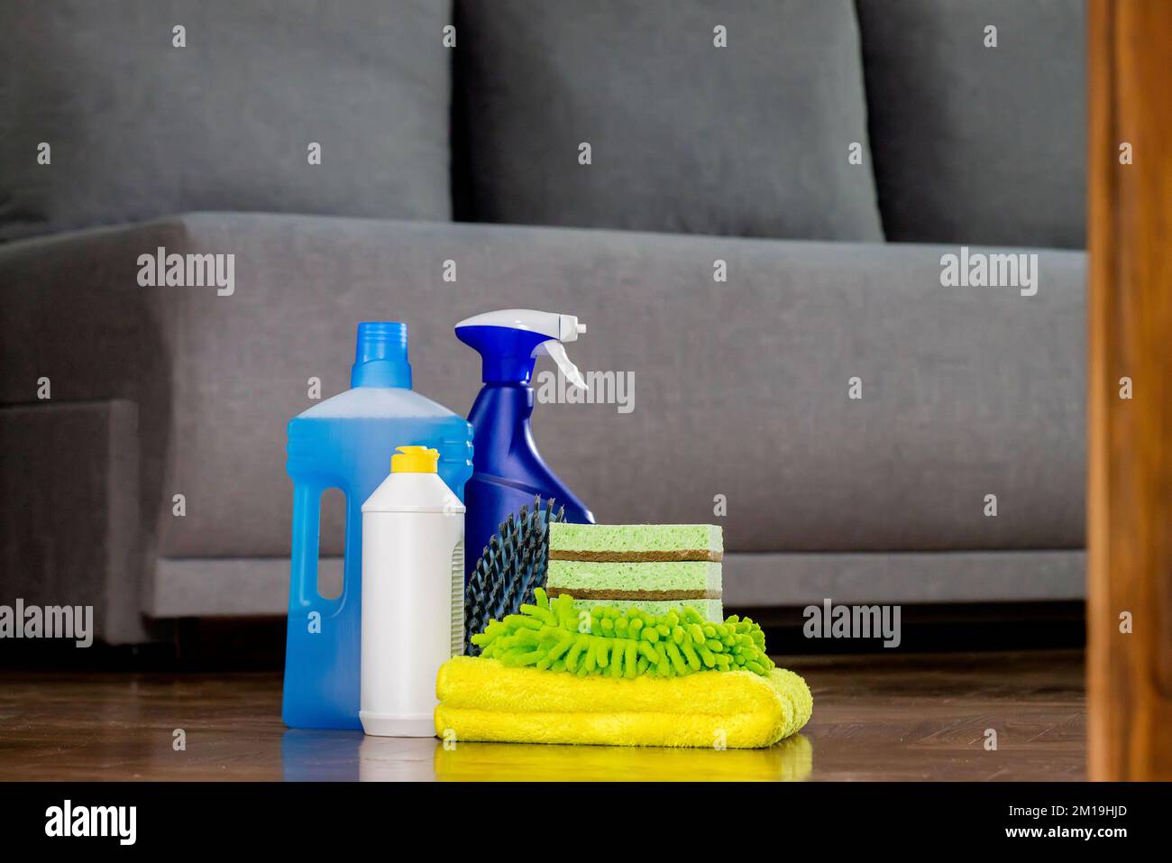 Household cleaning products and rags on floor. Chemical liquids for ...