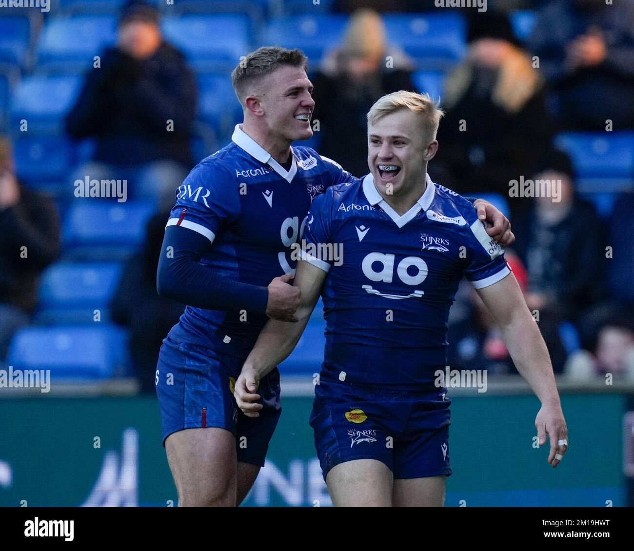 Tom Curtis #22 of Sale Sharks celebrates with try scorer Aaron Reed #14 ...