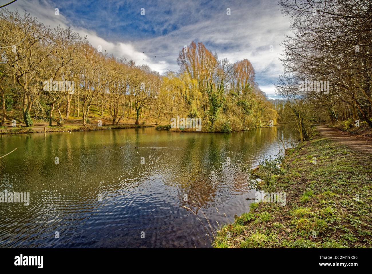 The path along the fishing lake and small island at Moss Valley ...