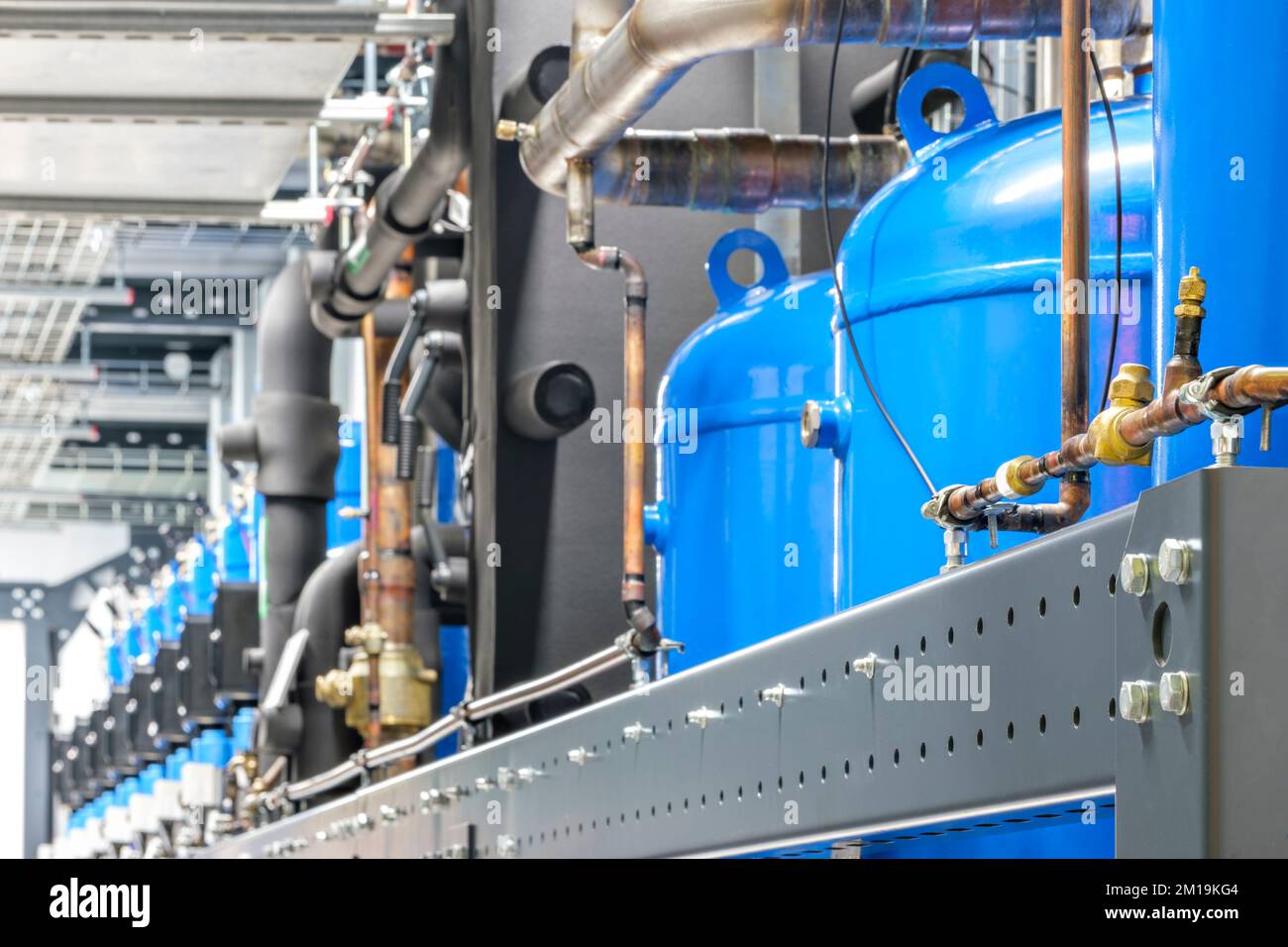 Large blue tanks in a industrial city water treatment boiler room ...