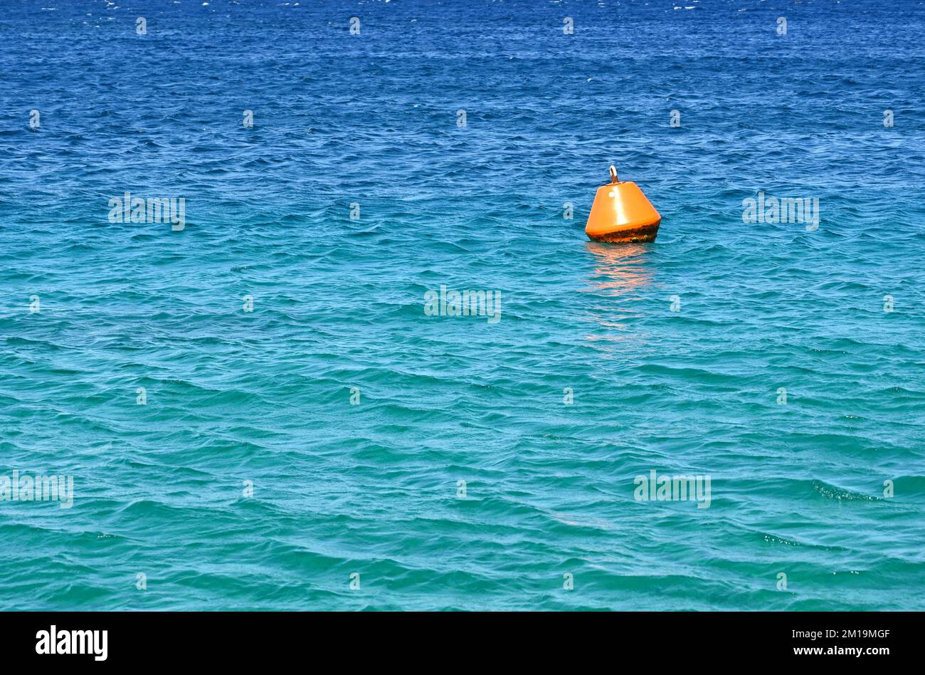 Orange buoy floating on the sea as a warning to ships. No people. Copy ...