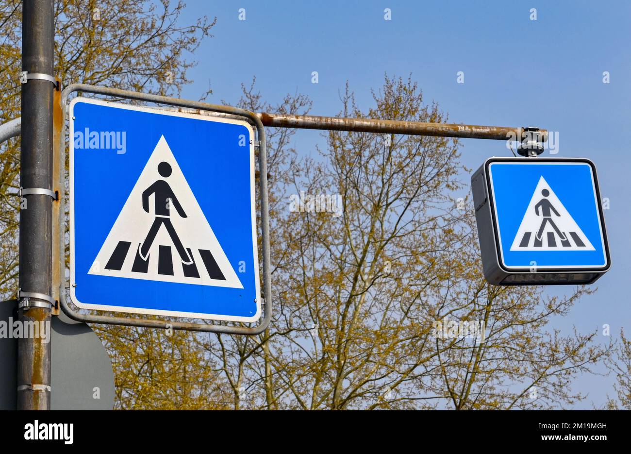Road signs in Germany warning drivers of a pedestrian crossing ahead ...
