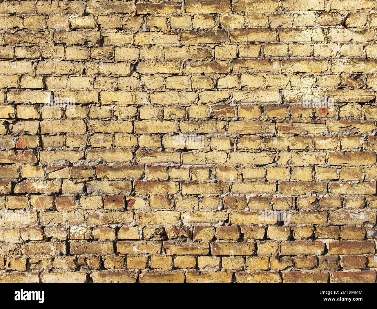 Old yellow brown brick wall background texture. Brick wall of ...